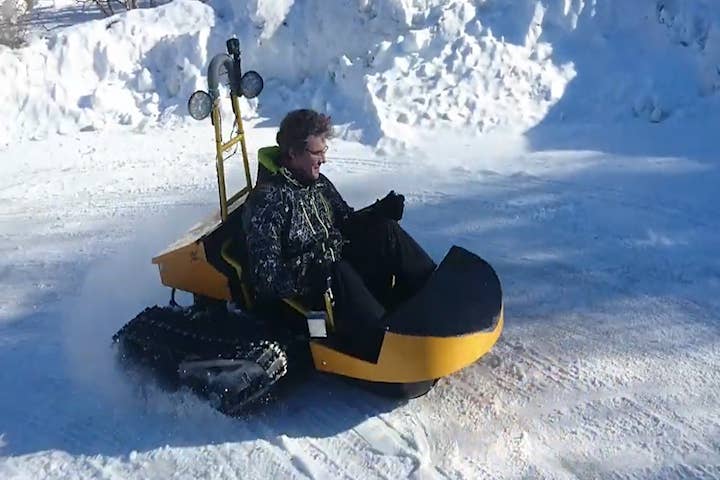 This electric snow sled has a top speed of 28 mph