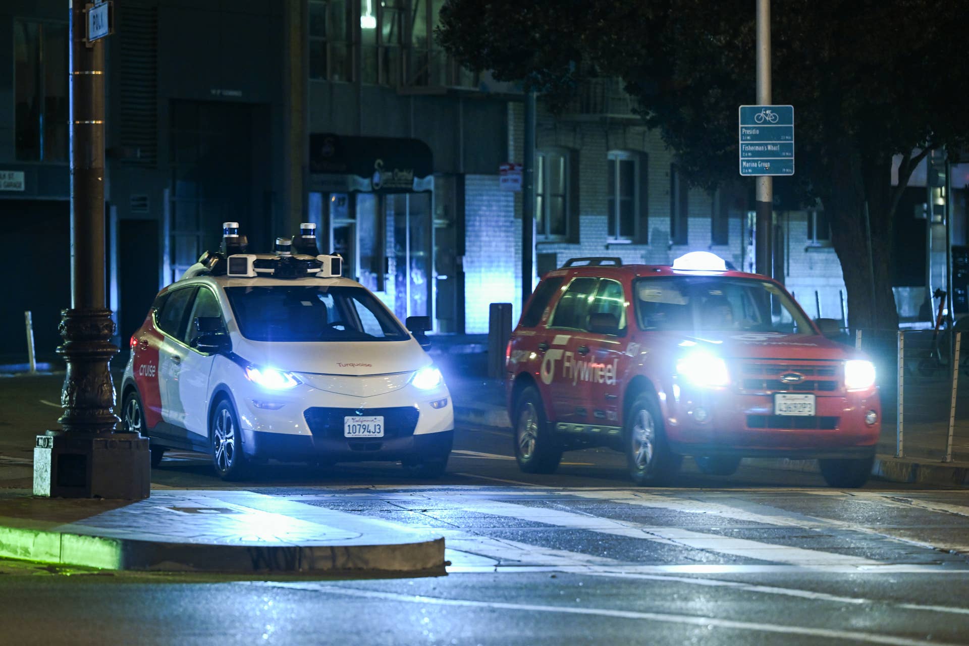 Autonomous Cruise taxi drives through road construction site into ...