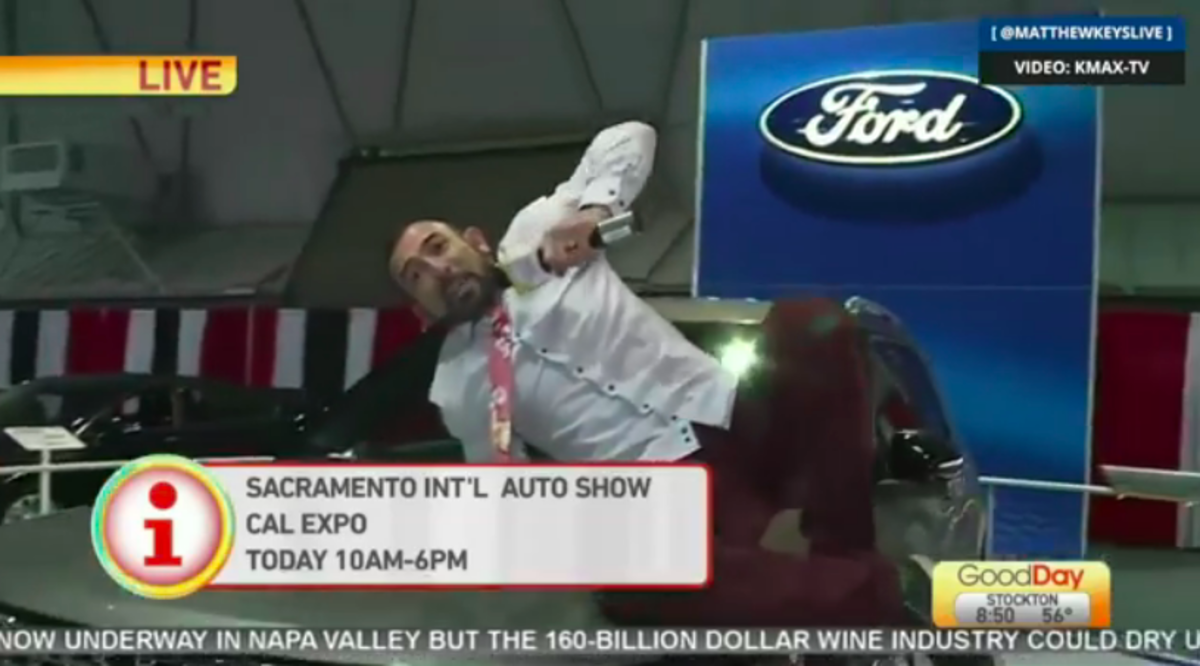 TV reporter fired after climbing on cars live at auto show - Autoblog