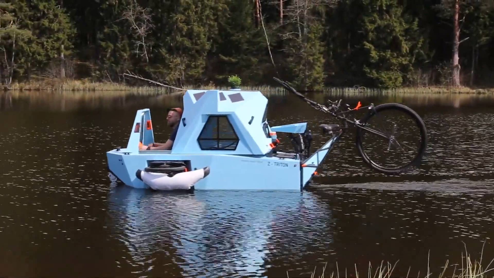 This electric tricycle/camper/boat looks straight out of a Wes Anderson ...