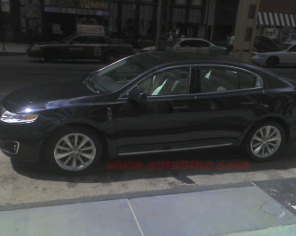 Spy Shots: Lincoln MKS in the buff on the set of Batman - Autoblog