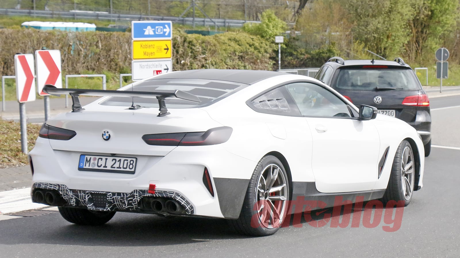 Possible BMW M8 GTS spied with a big wing and bright orange accents ...