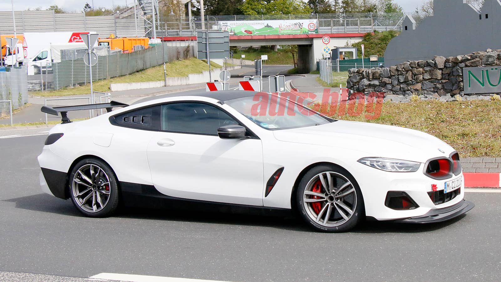 Possible BMW M8 GTS spied with a big wing and bright orange accents ...