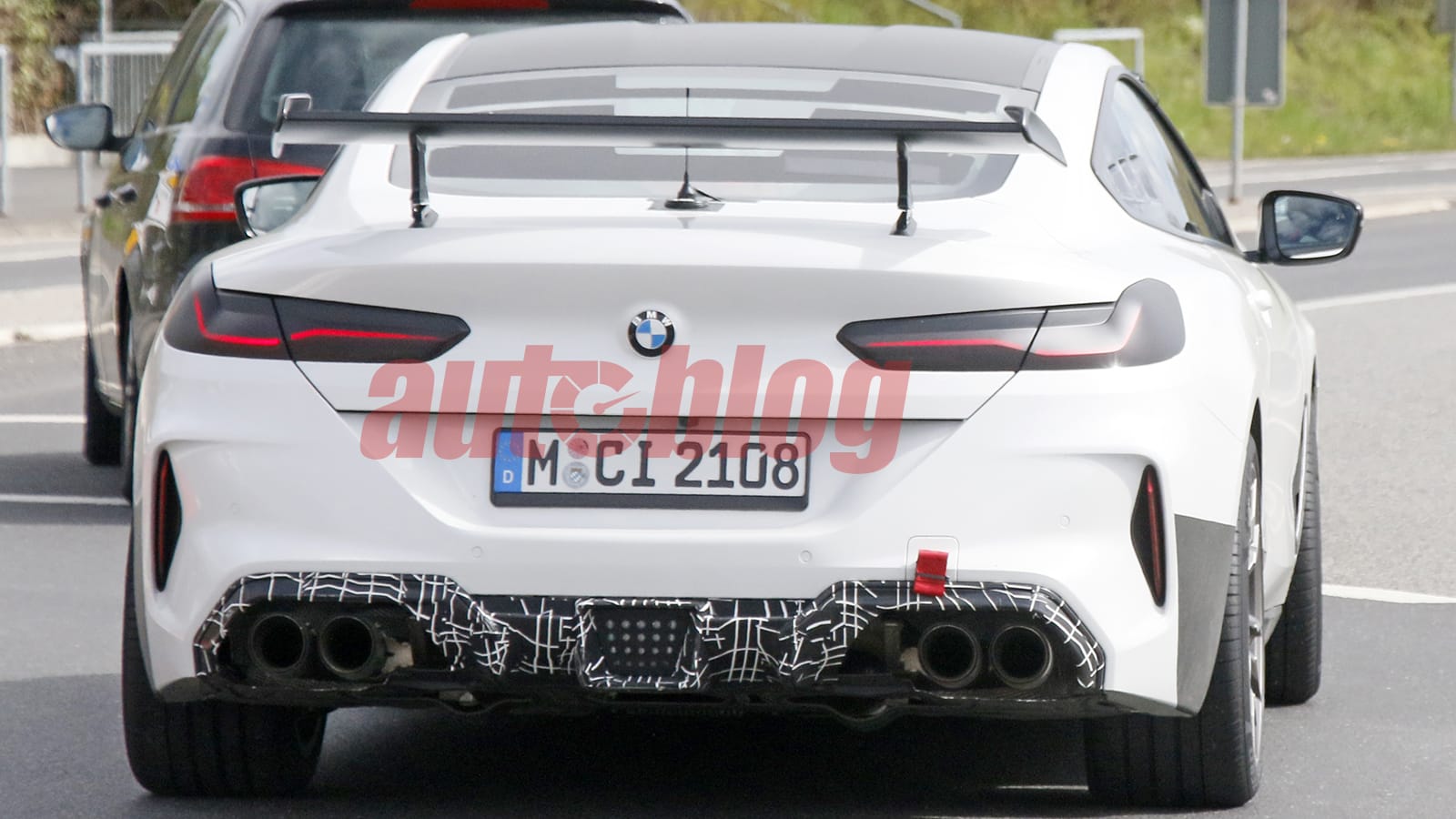Possible BMW M8 GTS spied with a big wing and bright orange accents ...