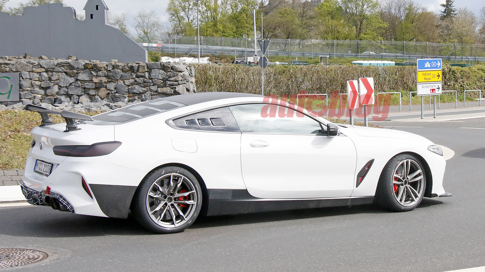 Possible BMW M8 GTS spied with a big wing and bright orange accents ...