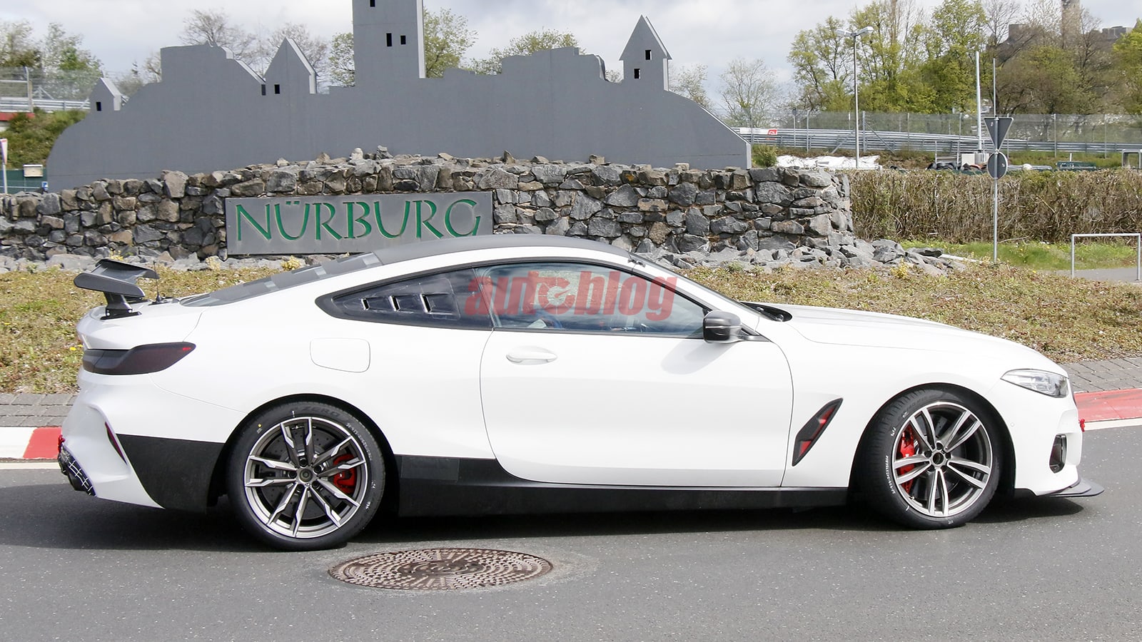 Possible BMW M8 GTS spied with a big wing and bright orange accents ...
