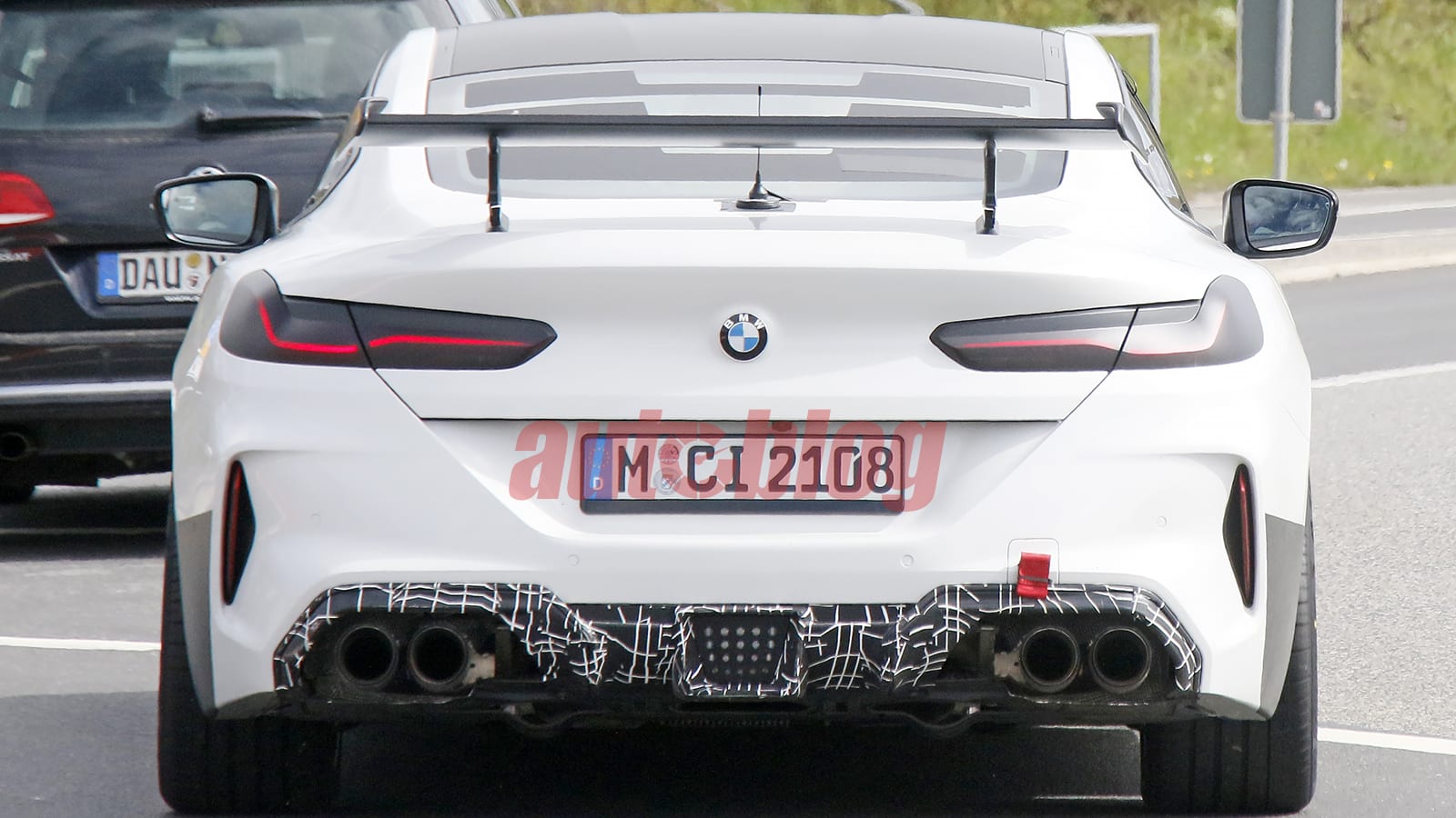 Possible BMW M8 GTS spied with a big wing and bright orange accents ...