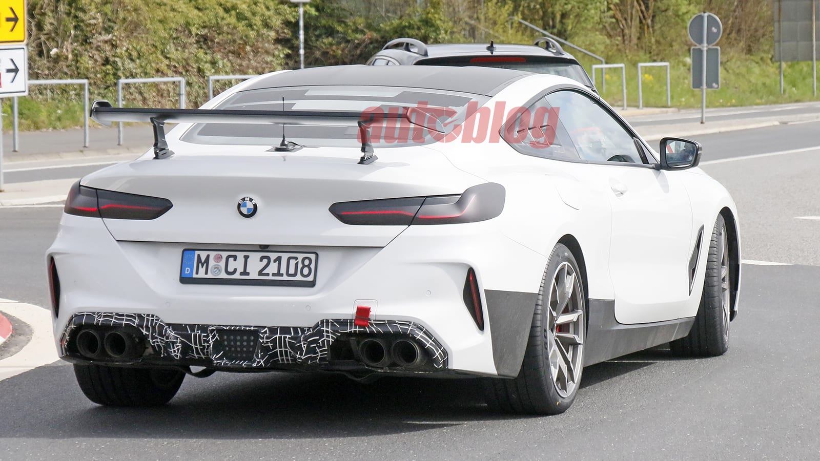 Possible BMW M8 GTS spied with a big wing and bright orange accents ...