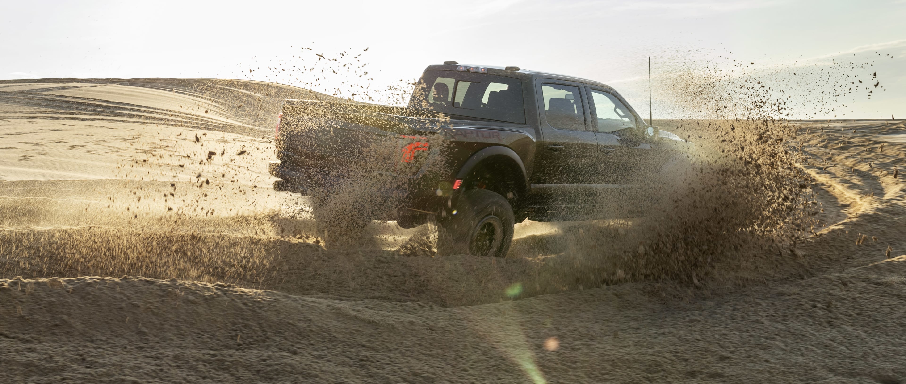 Ford F-150 Raptor vs Ram 1500 RHO: Super Truck Shootout - Autoblog